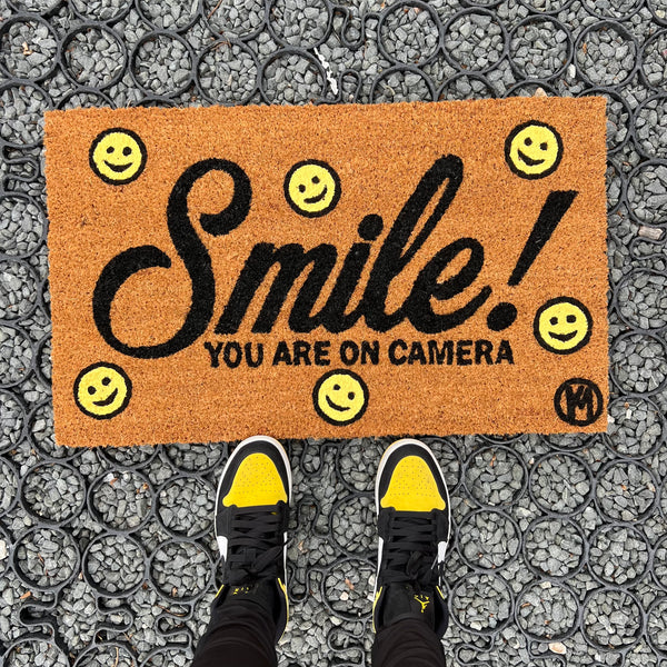 SMILE YOU ARE ON CAMERA MAT – Kicky Mats